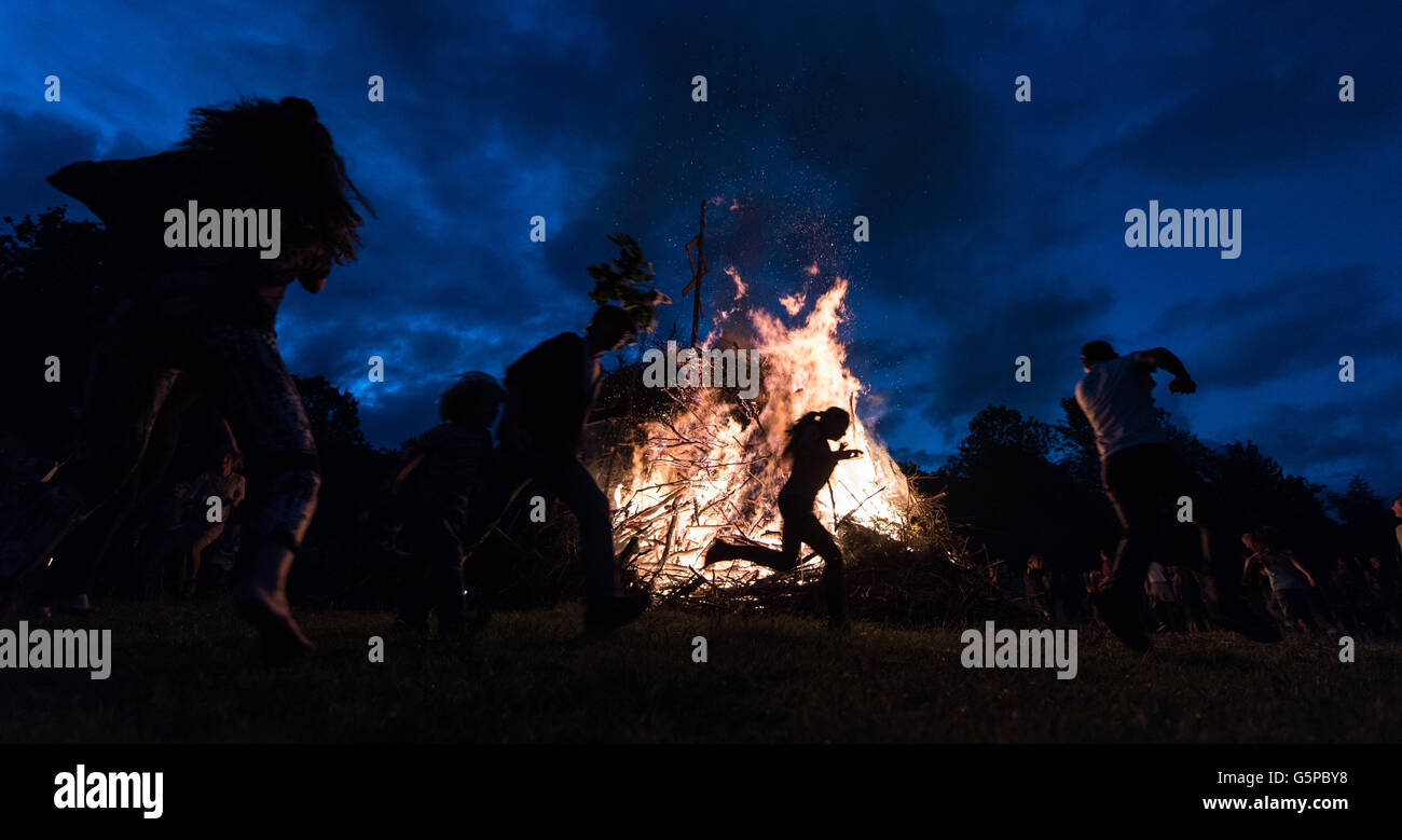 Freiburg, Germany. 21st June, 2016. People dance around the midsummer ...