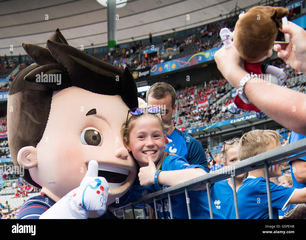 St. Denis, France. 22nd June, 2016. Iceland fans pose with mascot Super ...