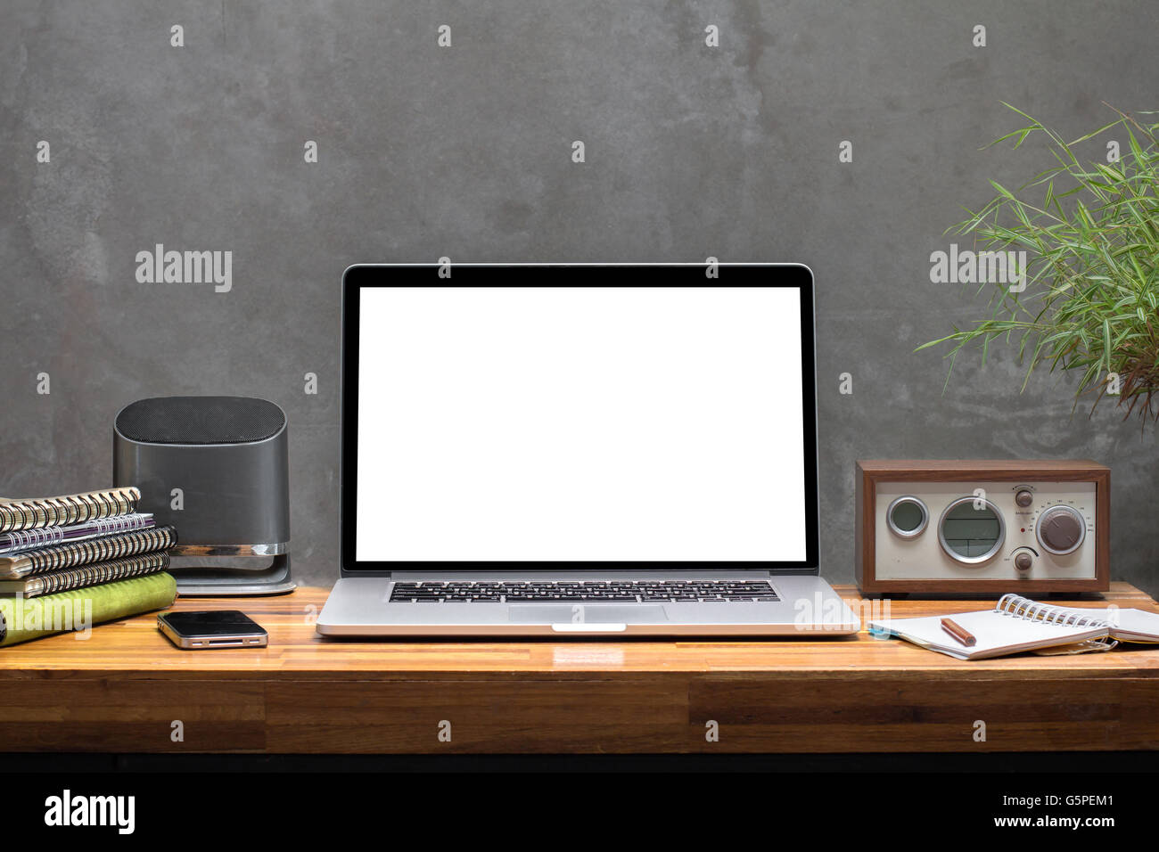 blank screen laptop on wooden worktable concrete wall background Stock ...