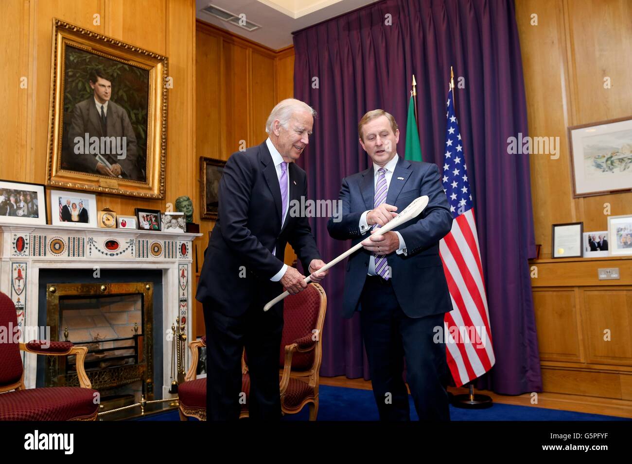 U.S. Vice President Joe Biden is given a cricket bat by Irish Taoiseach ...