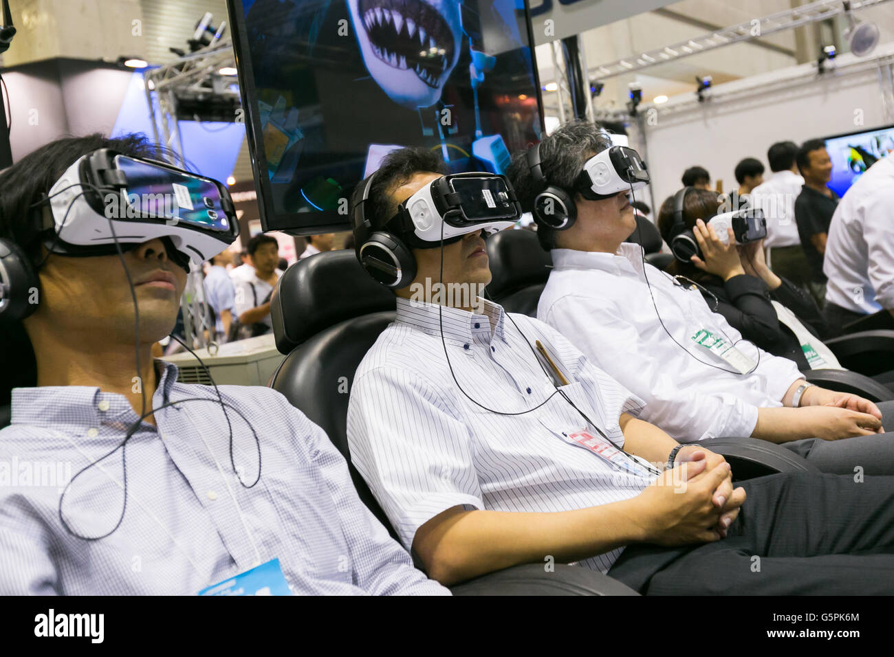 Tokyo, Japan. 23rd June, 2016. Visitors test virtual reality glasses at ...