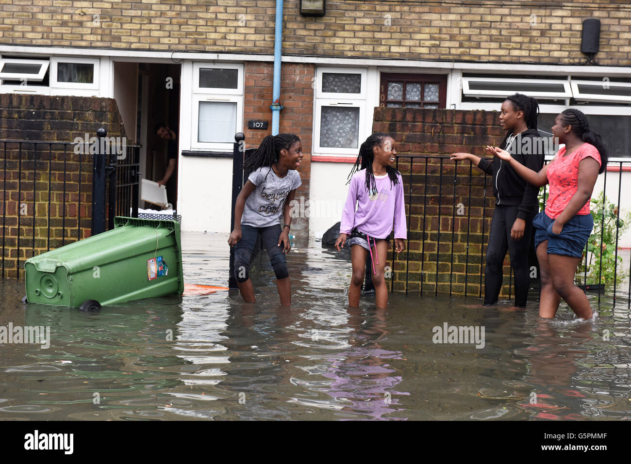 Children playing in flood water hi-res stock photography and images - Alamy