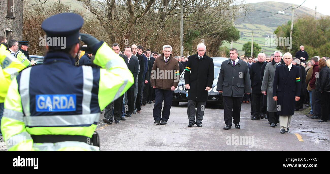 The coffin of former gaelic footballer Paidi O Se is brought through ...