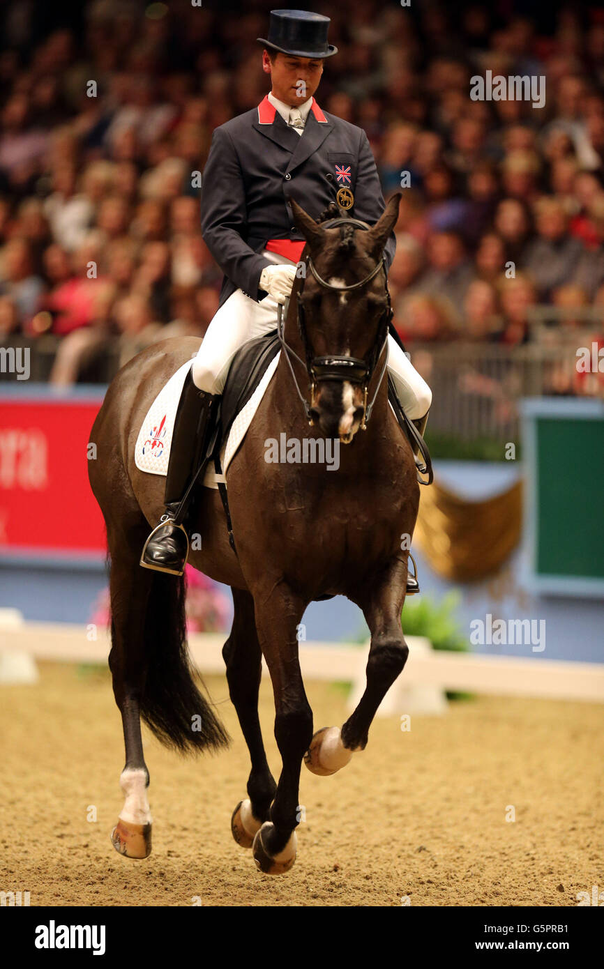 Great Britain's Carl Hester rides Uthopia in the Reem Acra FEI World ...
