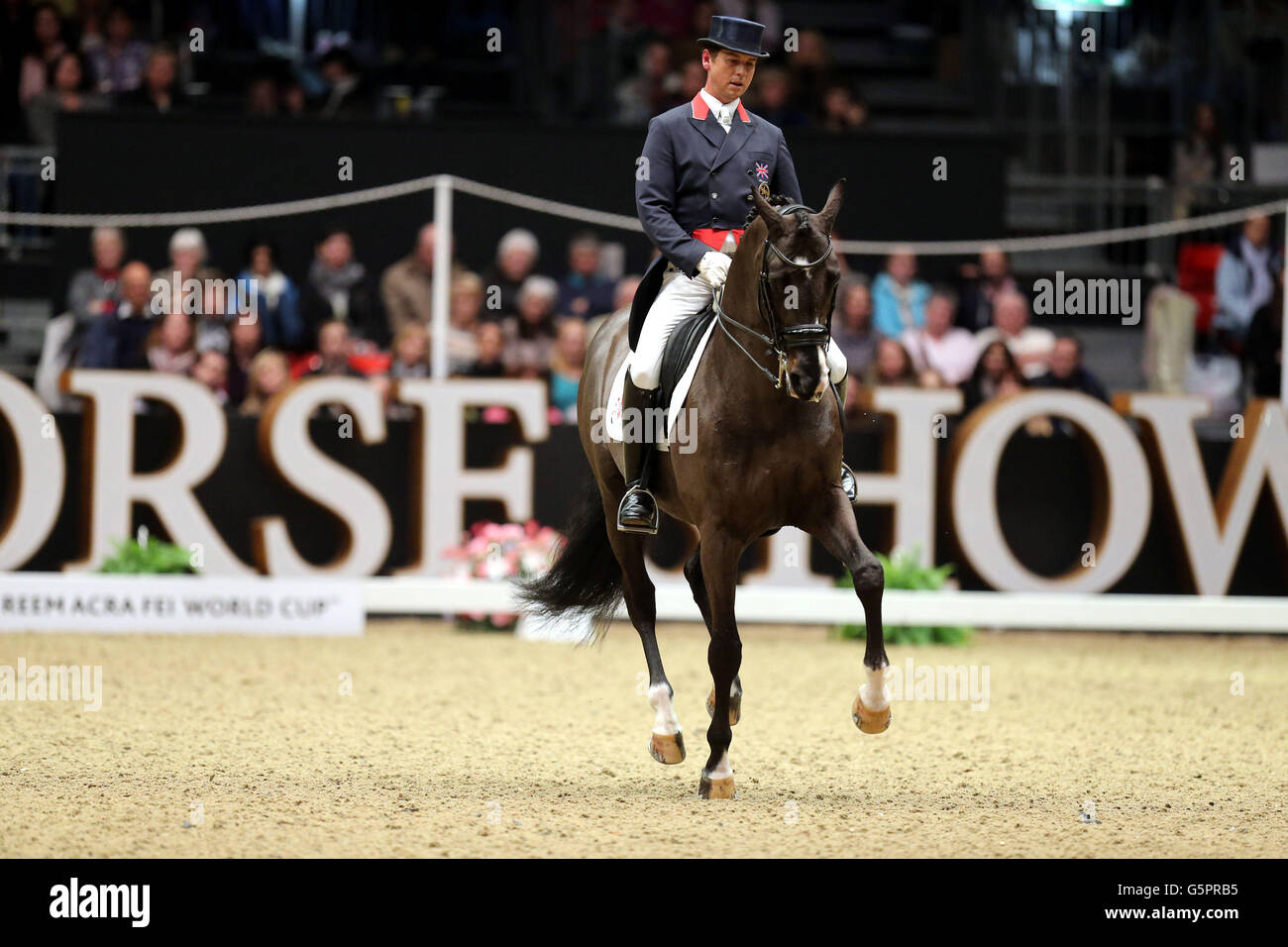 Great Britain's Carl Hester rides Uthopia in the Reem Acra FEI World ...