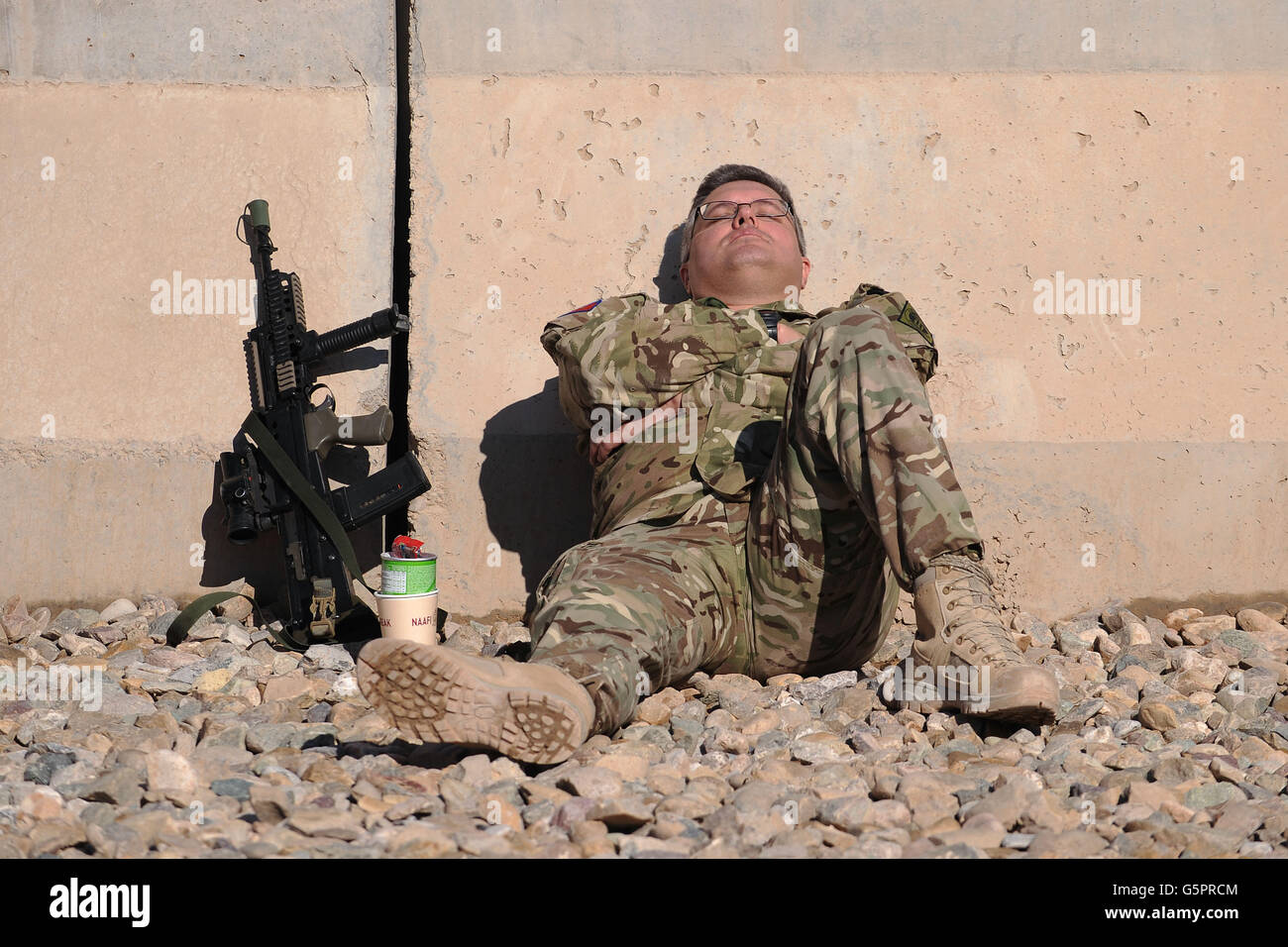 Staff Sergeant McCrimmon of the Labour Support Unit takes a break while ...