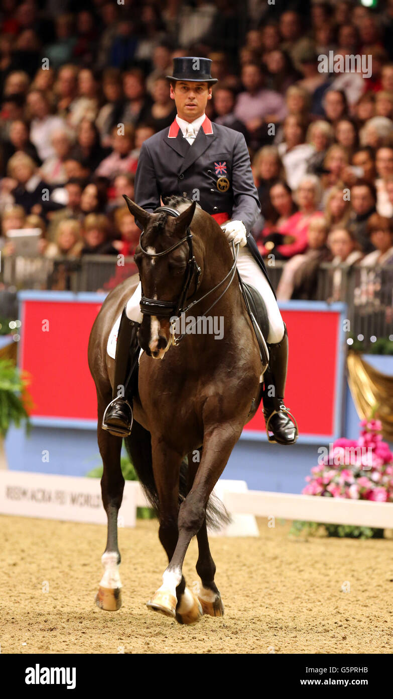 Great Britain's Carl Hester rides Uthopia in the Reem Acra FEI World ...