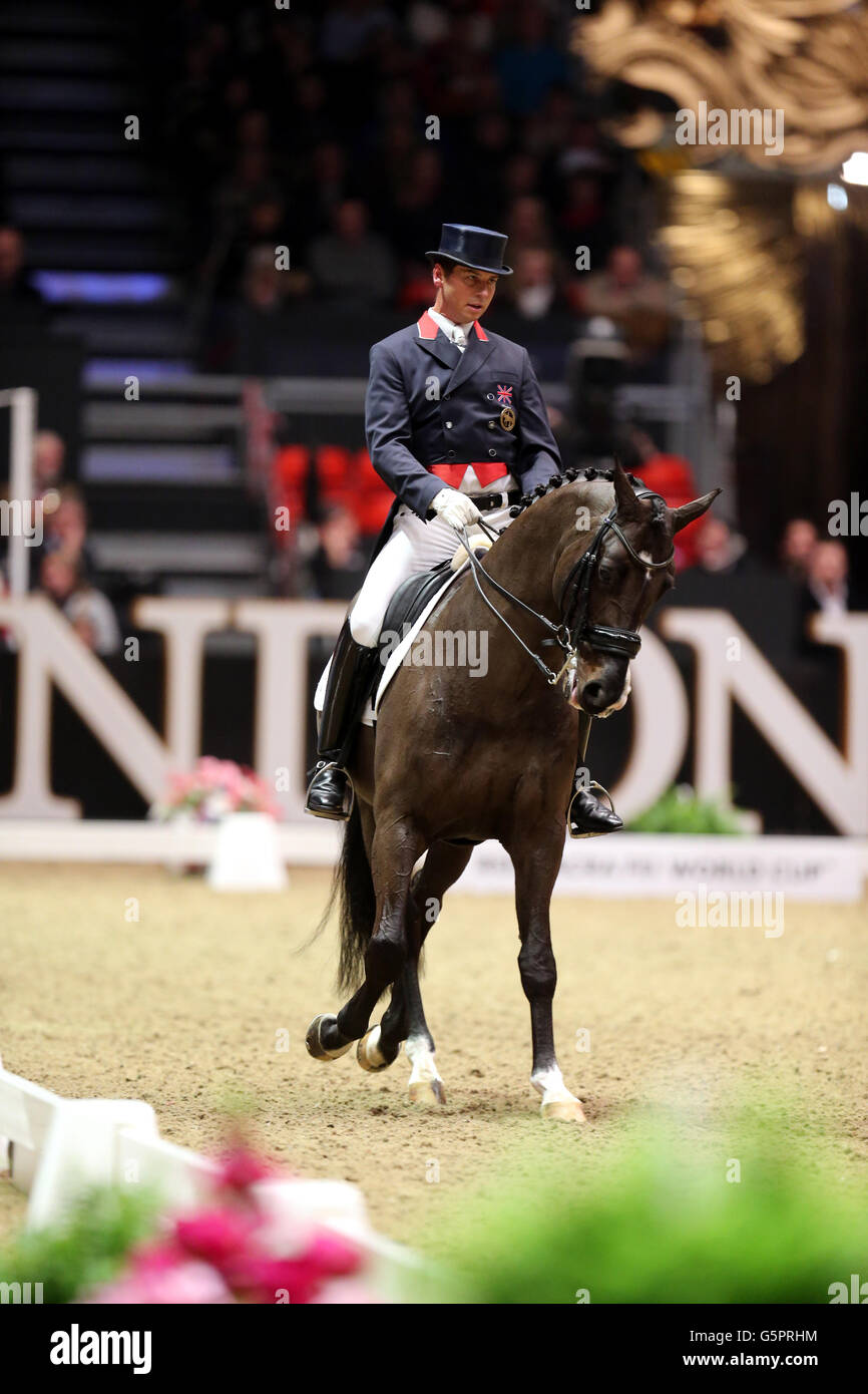 Great Britain's Carl Hester rides Uthopia in the Reem Acra FEI World ...