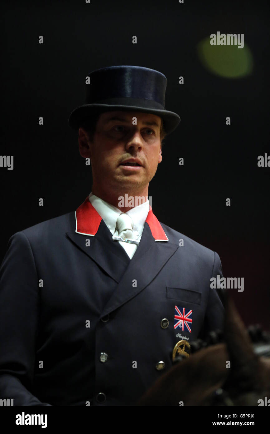 Great Britain's Carl Hester rides Uthopia in the Reem Acra FEI World ...