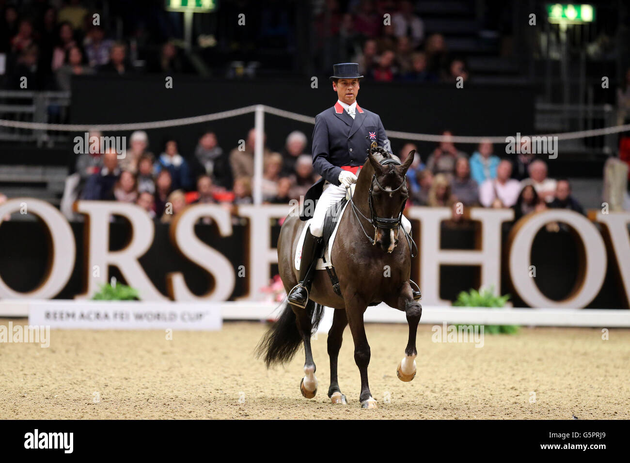 Great Britain's Carl Hester rides Uthopia in the Reem Acra FEI World ...