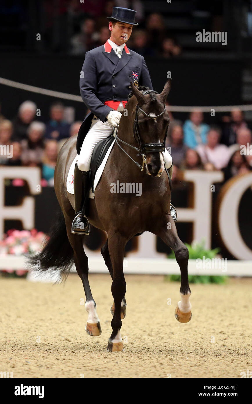Great Britain's Carl Hester rides Uthopia in the Reem Acra FEI World ...