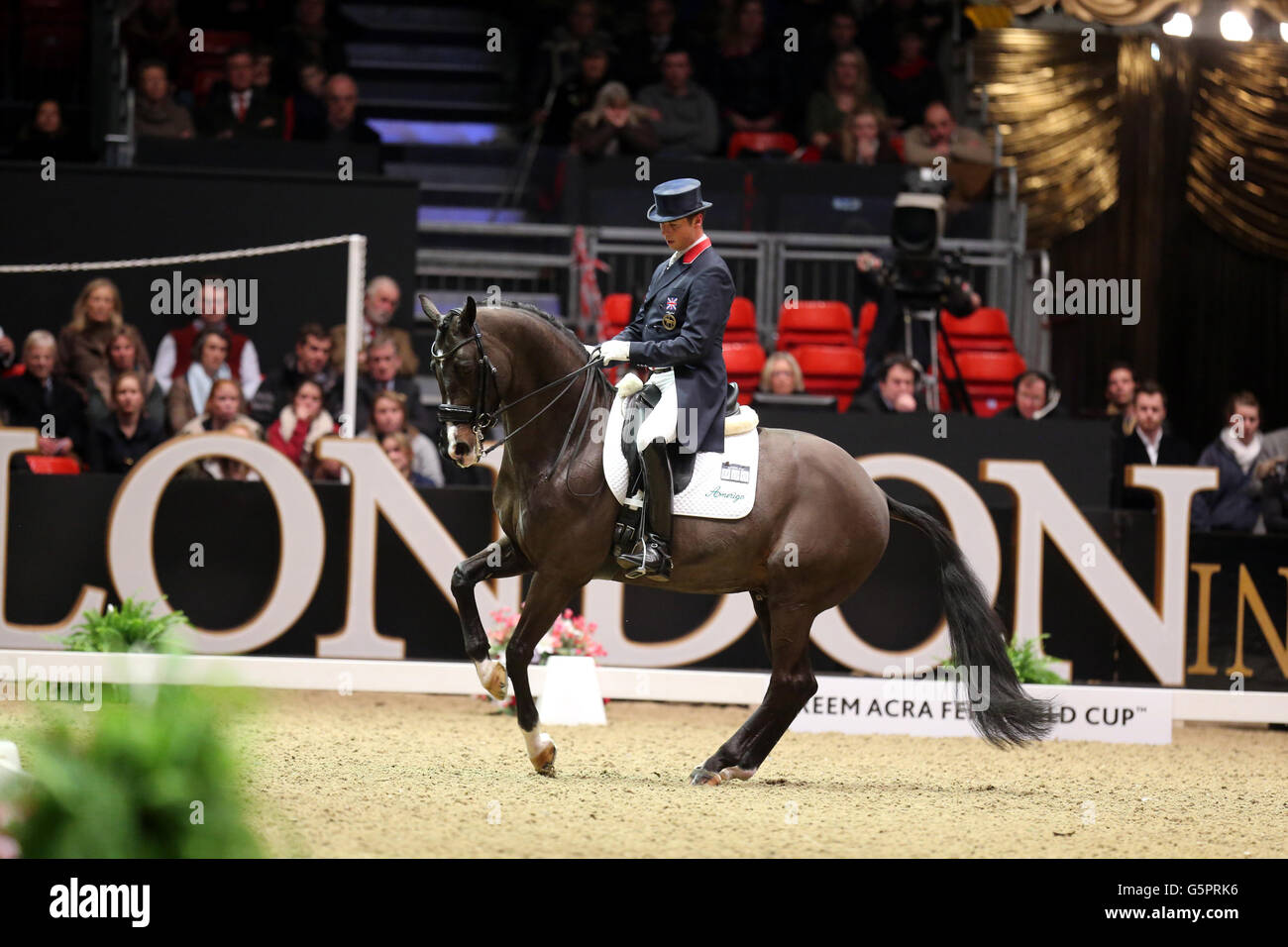 Great Britain's Carl Hester rides Uthopia in the Reem Acra FEI World ...
