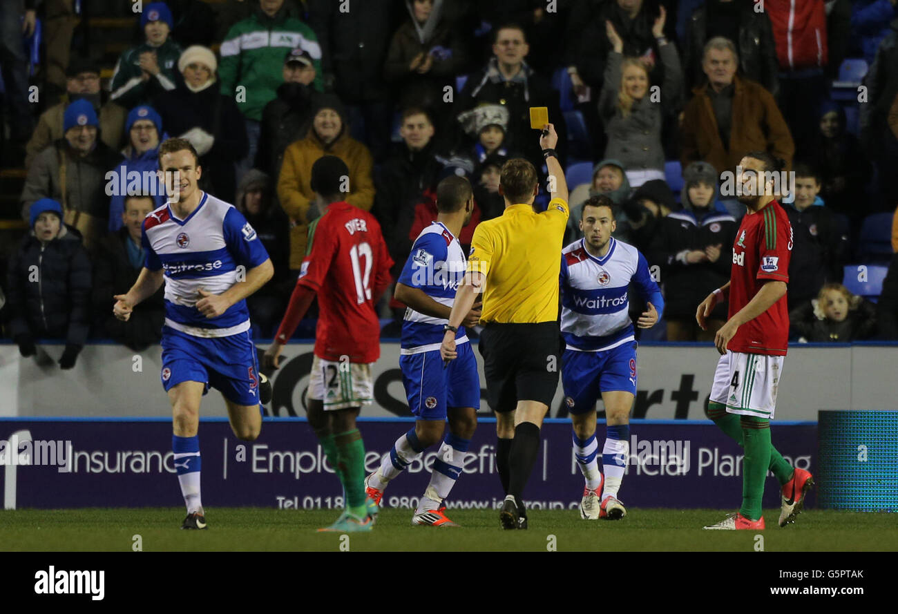Reading's Adam Le Frondre is booked by referee Mike Jones after he ...