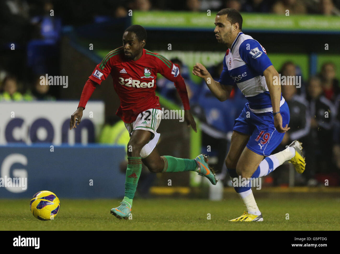 Swansea's Nathan Dyer breaks past Reading Adrian Mariappa during the ...