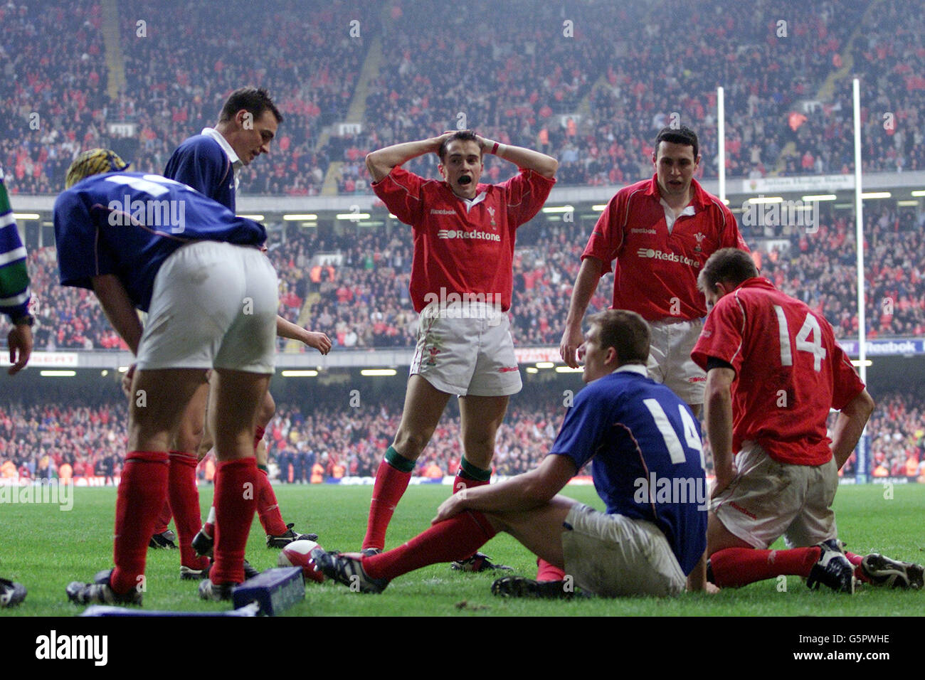 Rhys Williams of Wales holds his head after Dafydd James is denied by ...