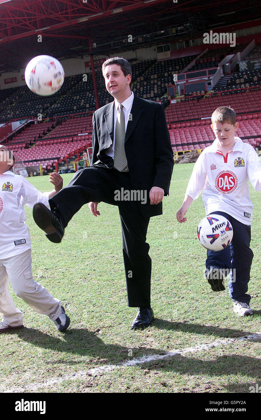 Minister for Young People and Learning, Ivan Lewis kicks a ball with ...