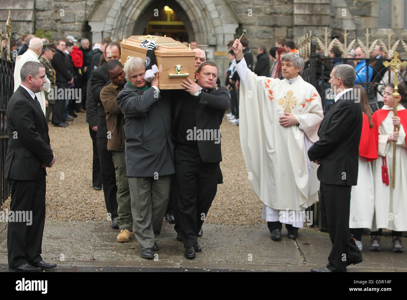 Mourners carry coffin at the funeral of Ian McKeever at the Church of ...