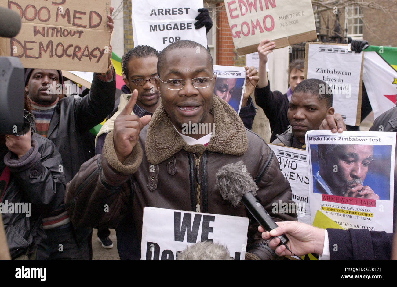 Adrian Lunga from the Freedom for Zimbabwe Campaign (centre Stock Photo ...