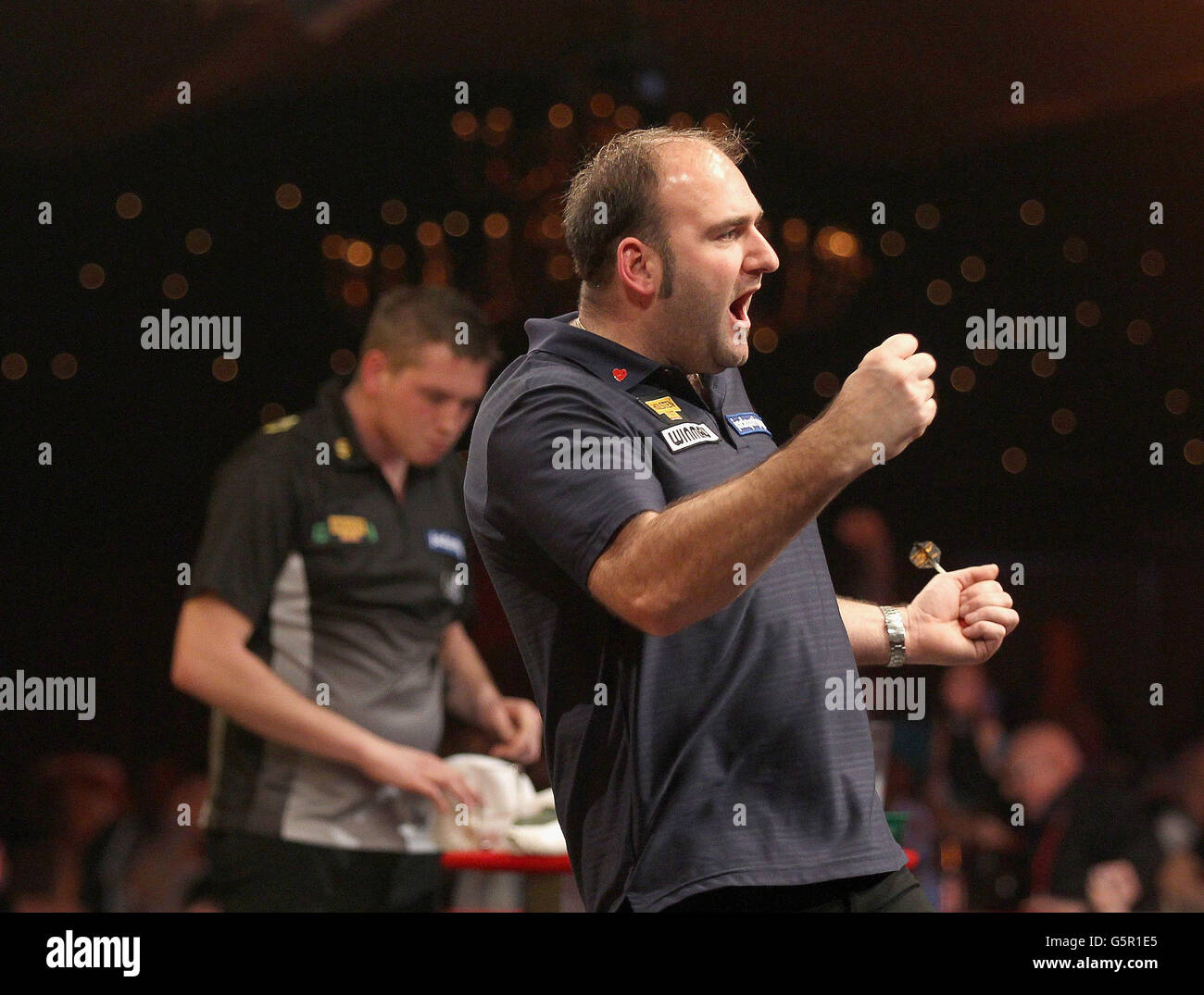 Scott Waites celebrates winning against Richie George during the BDO ...