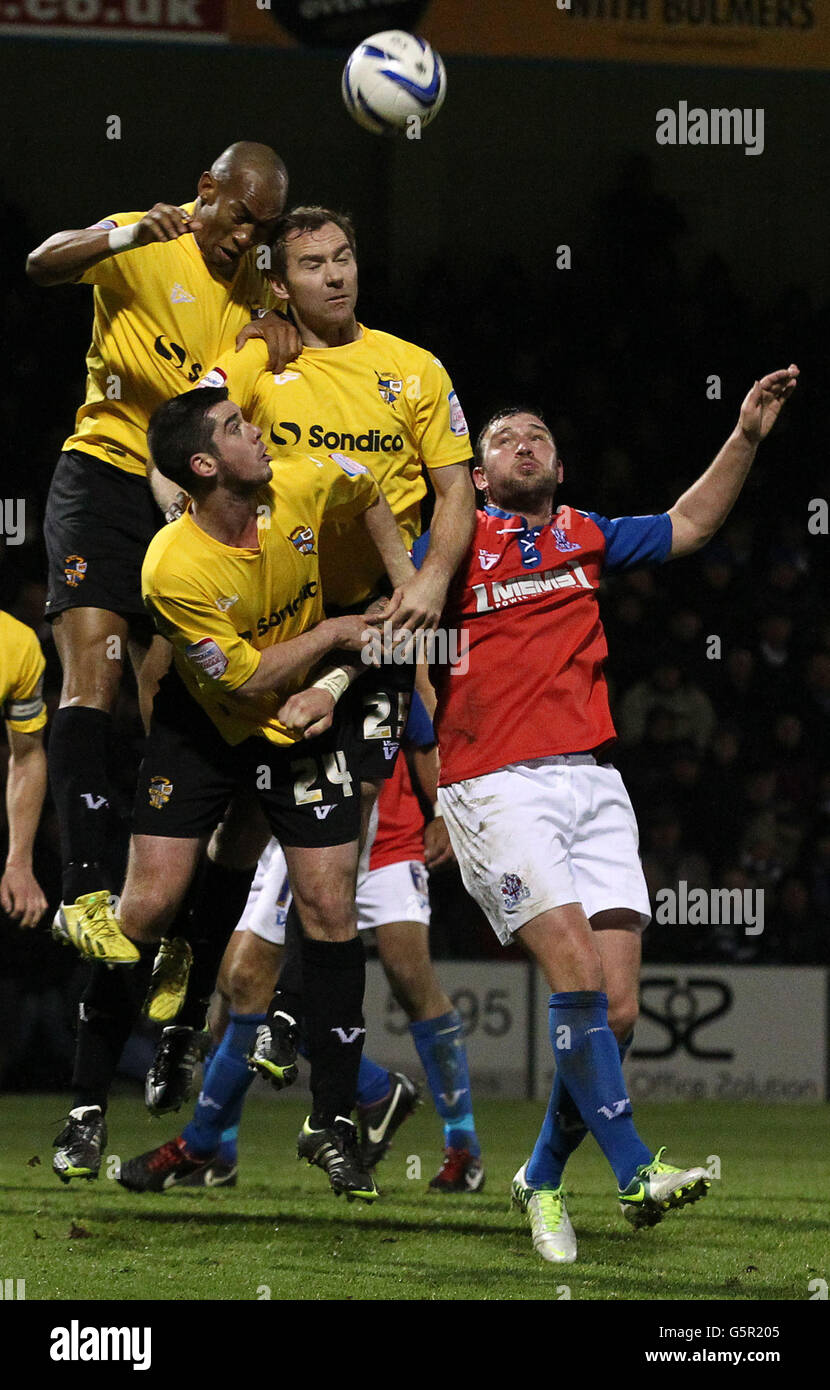Gillingham's Danny Kedwell (right) is challenged by the Port Vale ...
