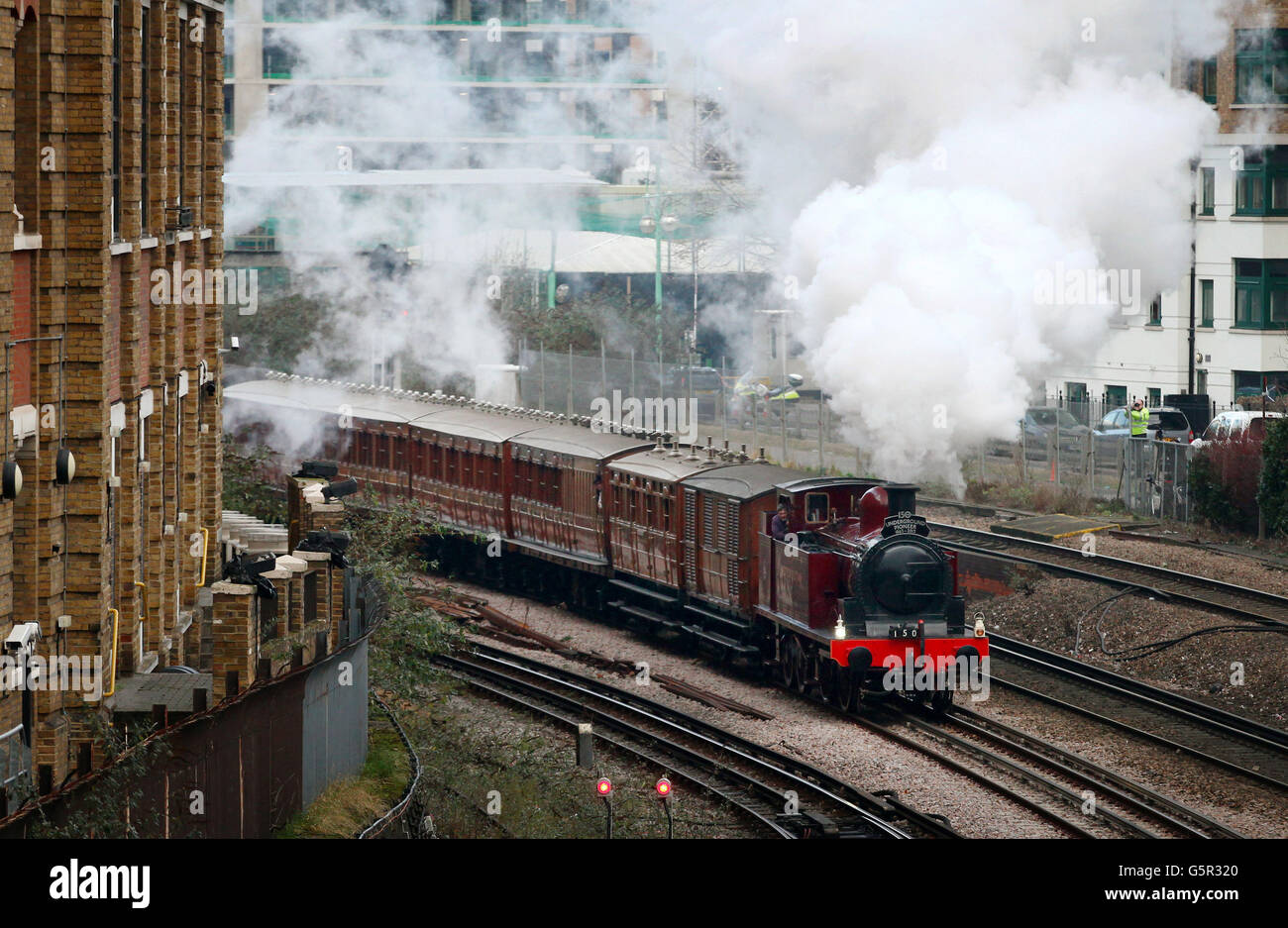 Metropolitan 1, a restored steam train travels near Earl's Court ...