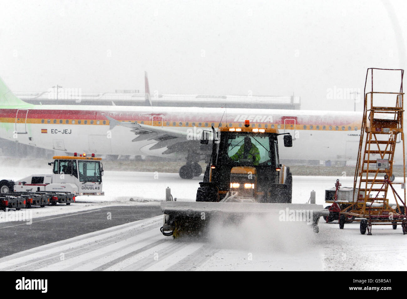 A snow plough clears snow from Heathrow Airport, as Britains transport ...