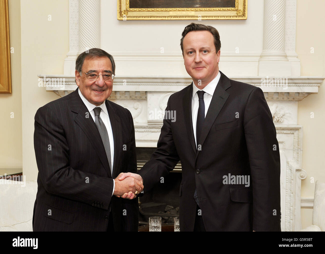 Prime Minister David Cameron shakes hands with Leon Panetta the US ...