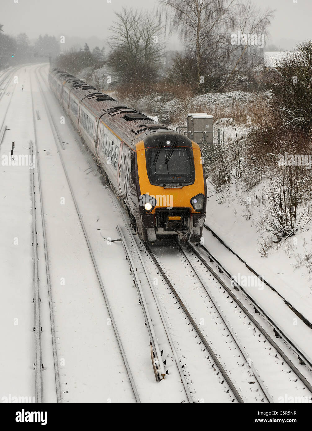 A Cross Country train makes it's way through the snow at Worting ...