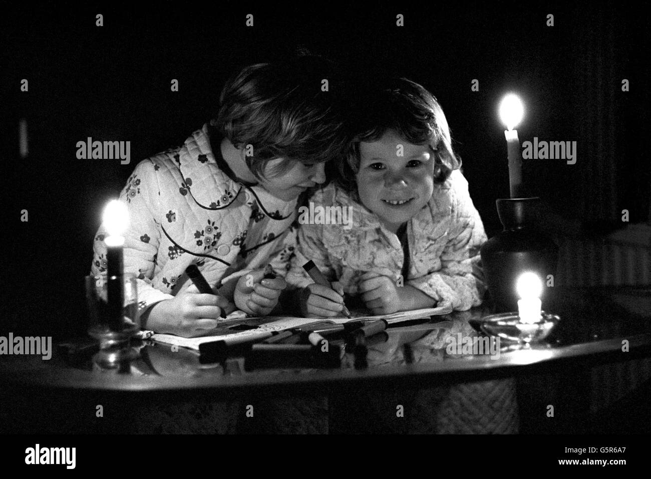 Colouring by candlelight Stock Photo - Alamy