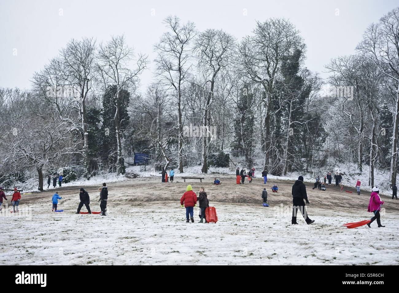 The snow slowly gives way to mud at the top of the hill at Arnos Park ...