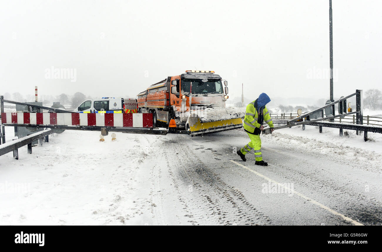 Two snow ploughs try and clear the A66 at Durham after it was closed as ...