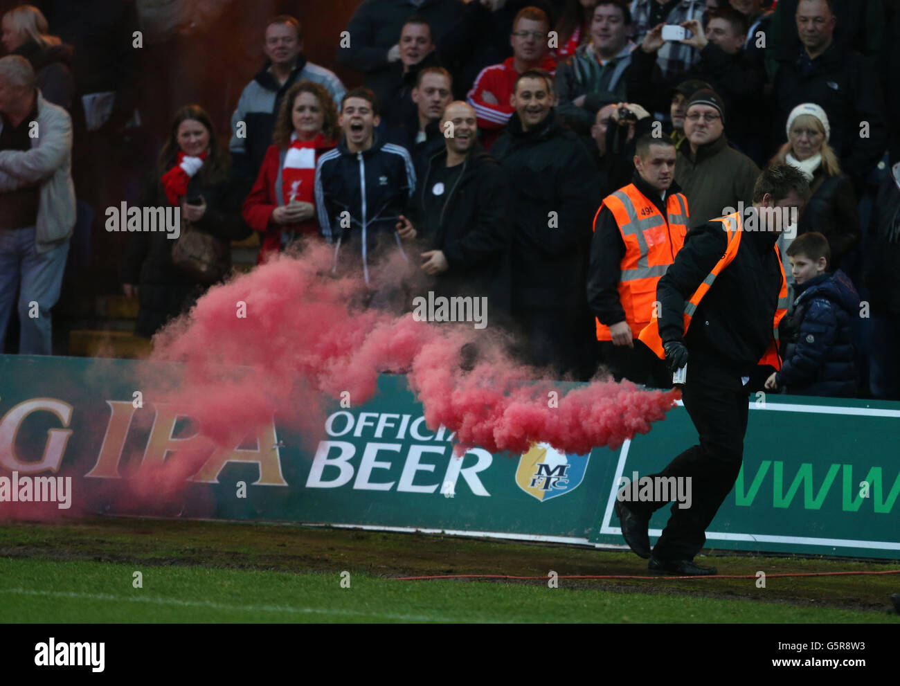 Steward removes red flare from the liverpool fans hi-res stock ...