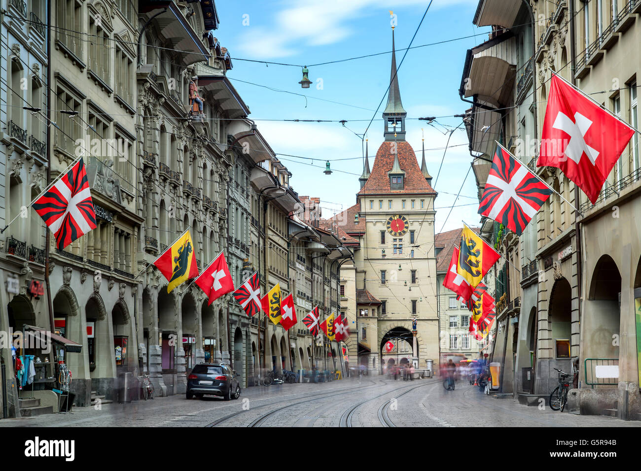 Shopping alley with the famous clocktower of Bern in Switzerland Stock ...