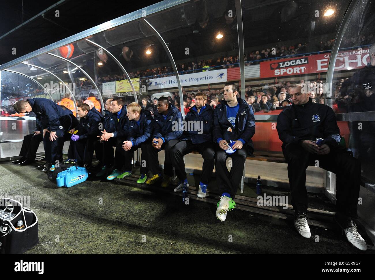 Everton players take their place on the bench before the match Stock ...