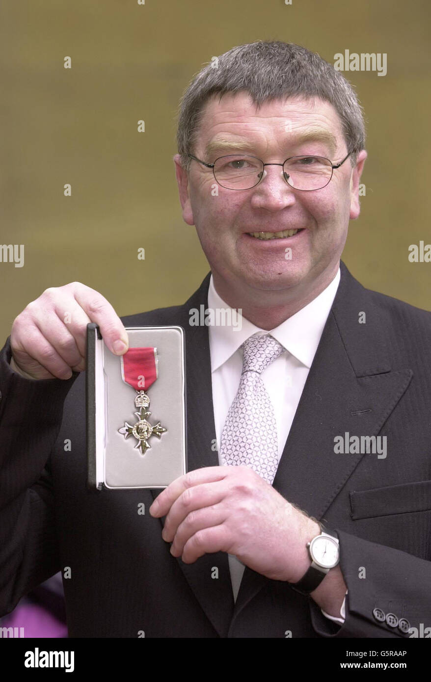 Investiture award medal proud smiling glasses suit hi-res stock ...