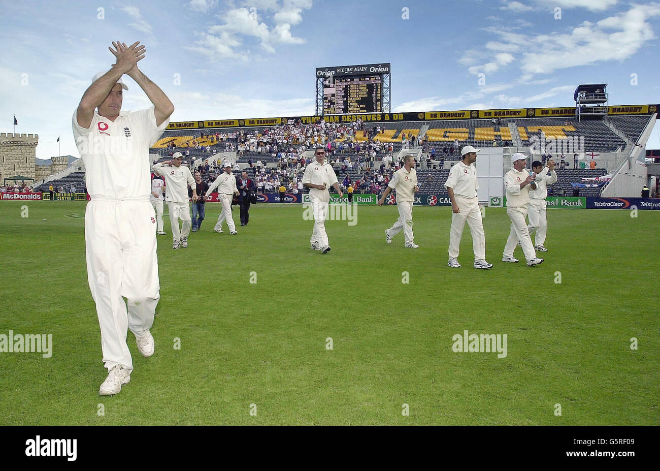 England skipper Nasser Hussain (left) and his team applaud the ...