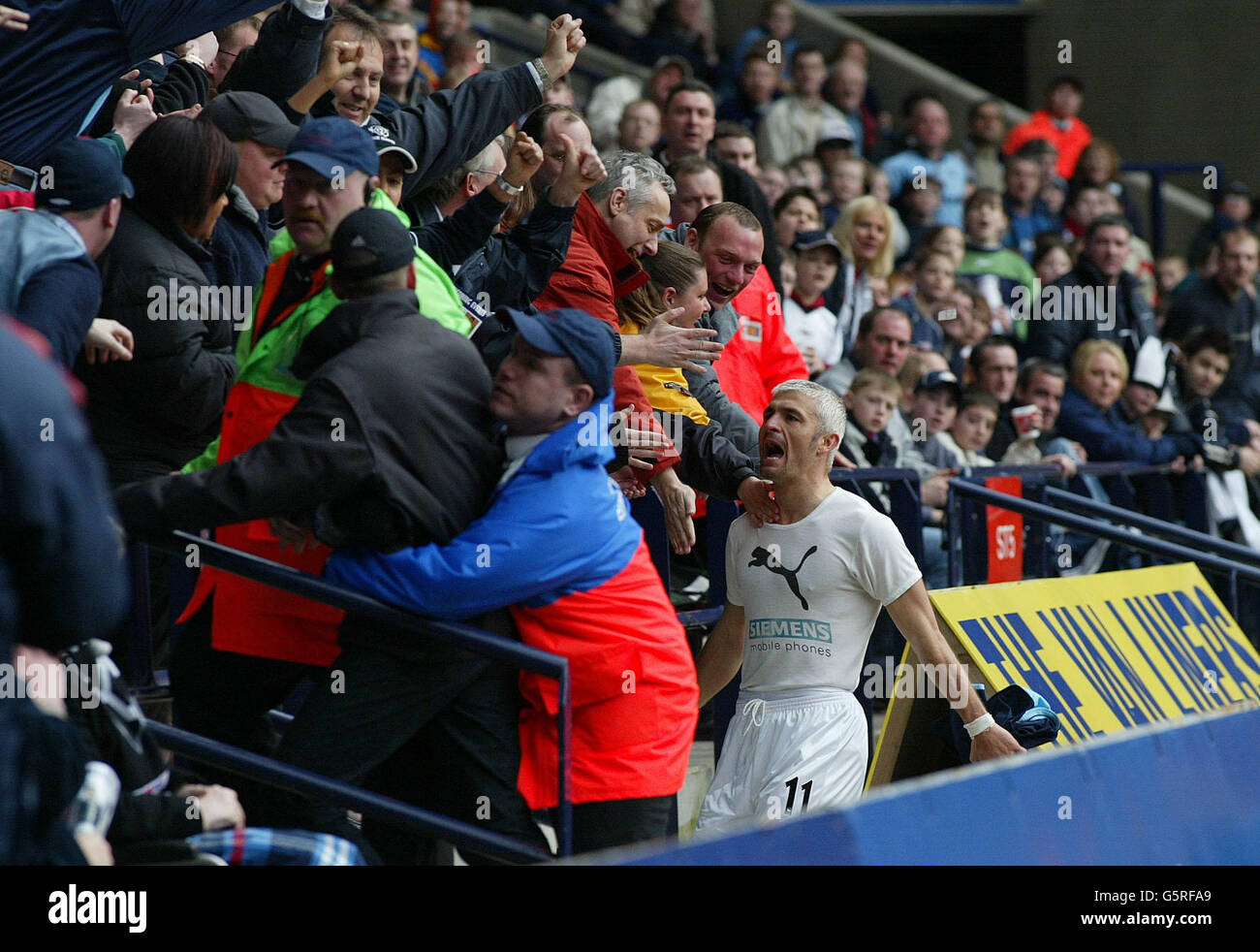 Stewards struggle to hold back supporters as Derby's Fabrizio Ravanelli ...