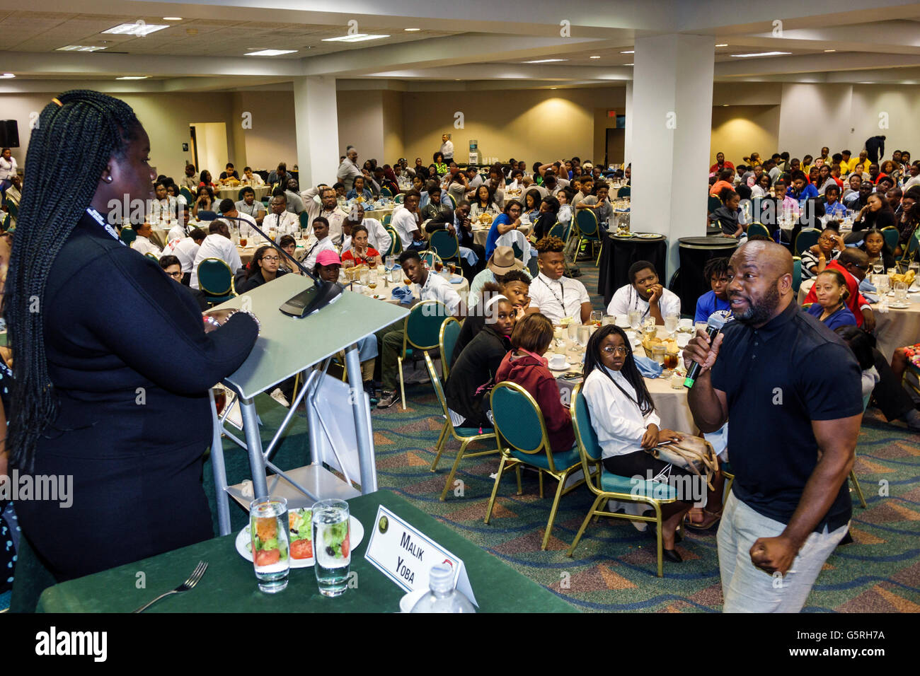 Black teen speaking into microphone hi-res stock photography and images ...