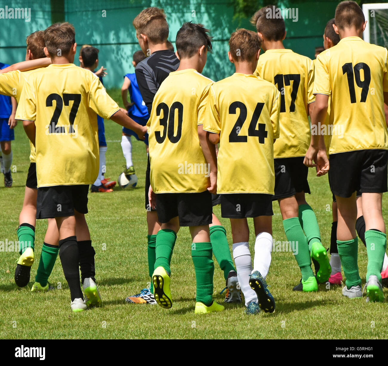 Young soccer players after the match Stock Photo - Alamy