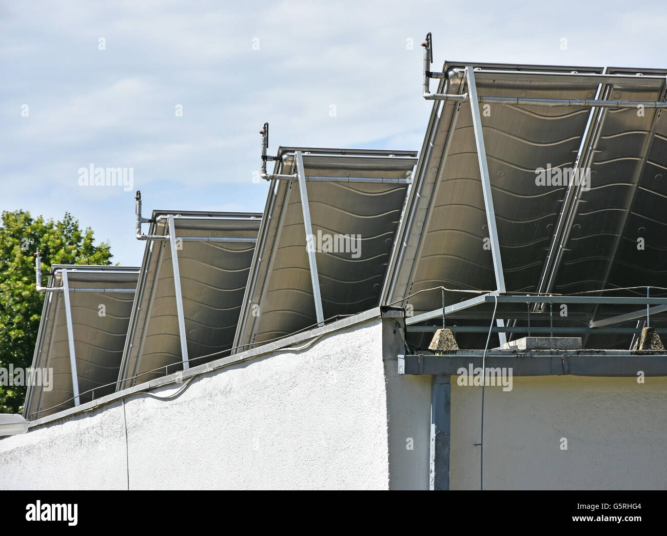 Solar panels on the top of a building rear view Stock Photo - Alamy