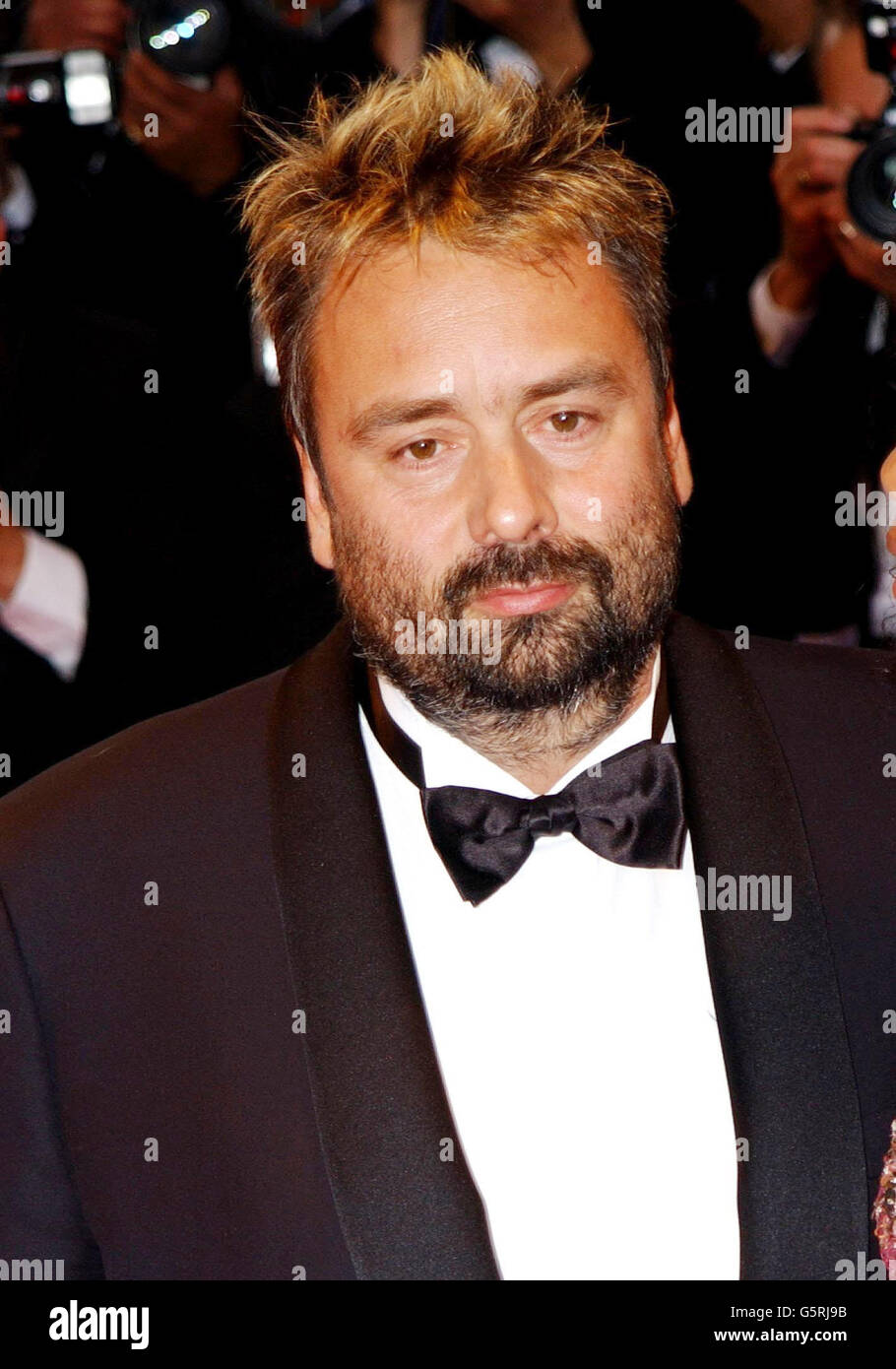 Luc Besson arrives at the Premiere of 'Punch-Drunk Love' at the Palais ...