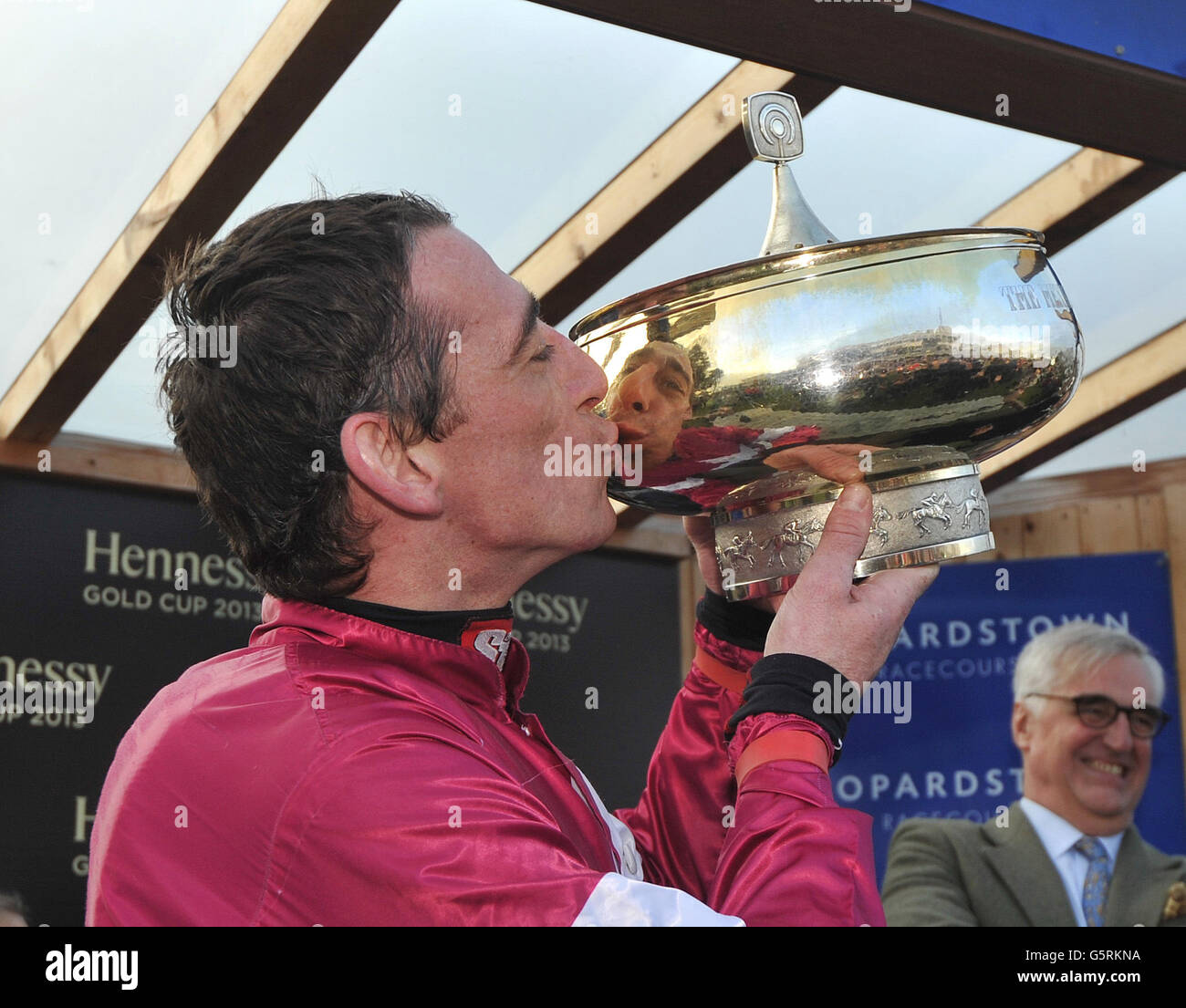 Jockey Davy Russell kisses the Hennessy Gold Cup after he rode Sir Des ...