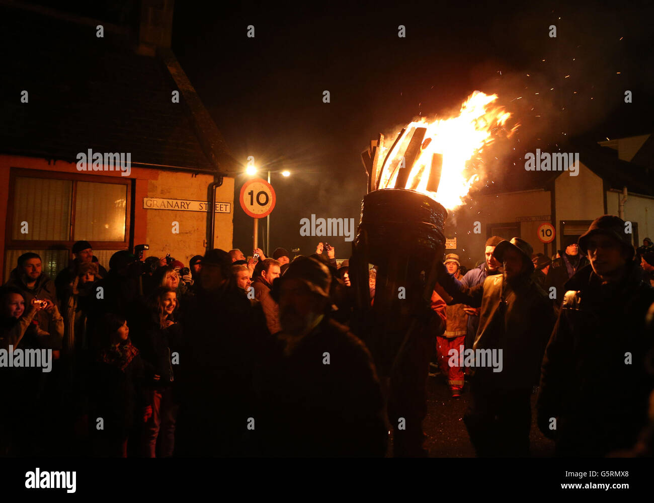 The Clavie King and his Clavie crew parade the Clavie through the ...