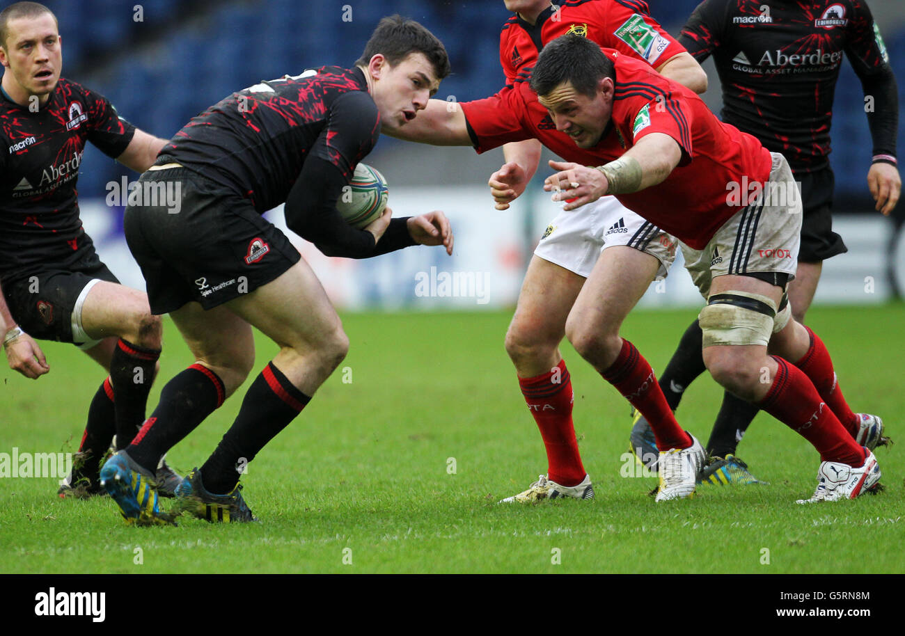 Edinburgh's Matt Scott and Munster's Damien Varley during the Heineken ...