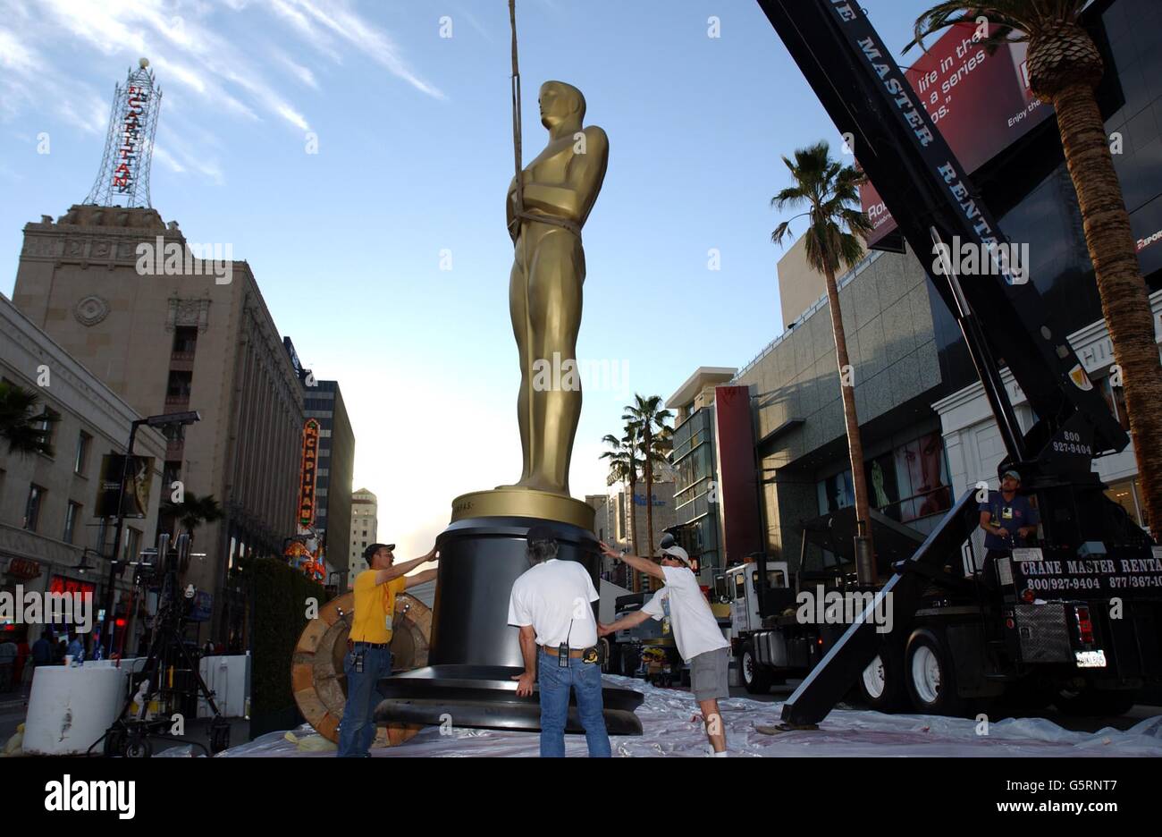 A giant Oscar statue is delivered as preparations continue for the 74th ...