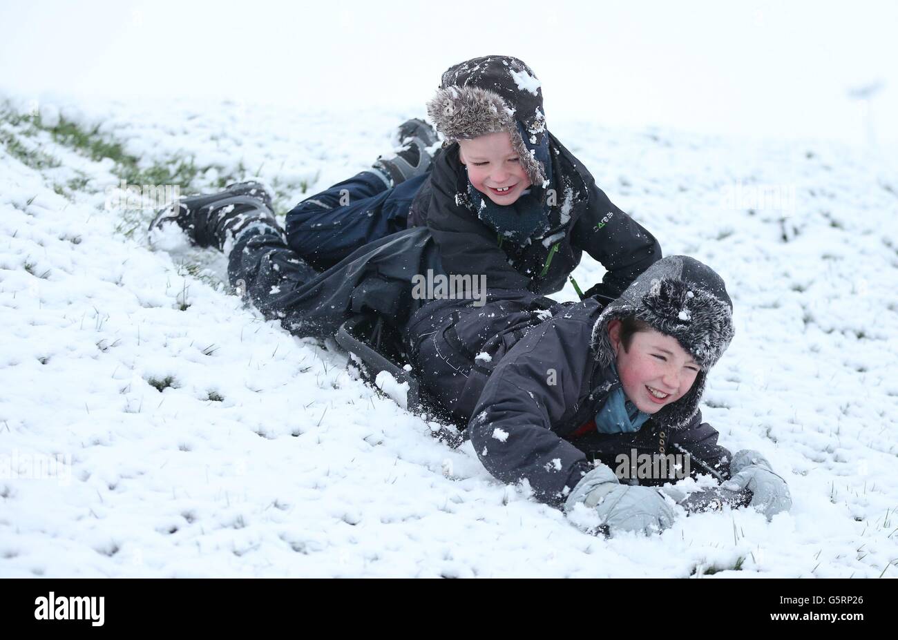 Daniel and James Egerton play on their sledge in Bingham ...