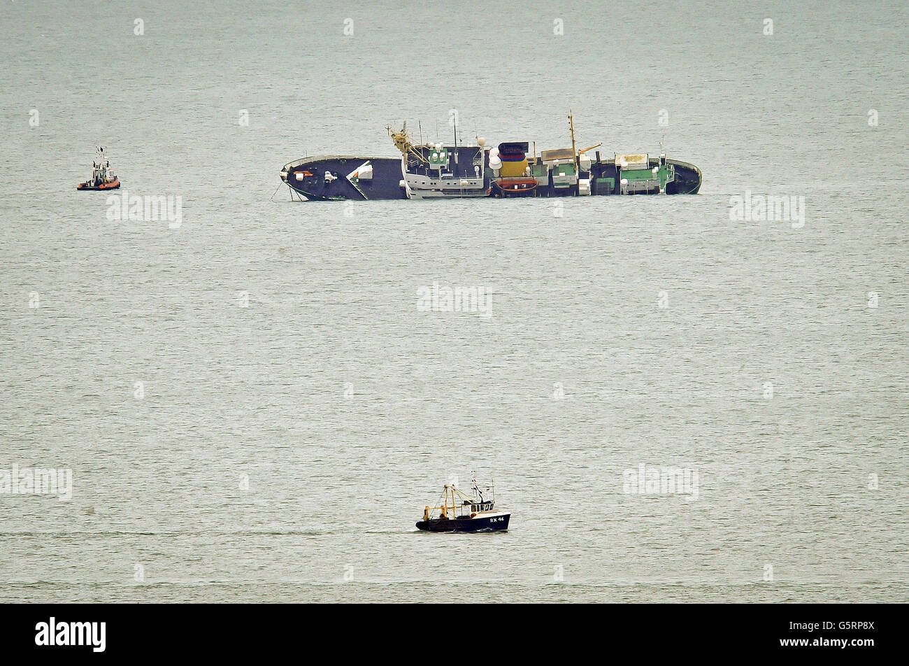The Moto Vessel Emsstrom lists in the sea, which was being towed by the ...