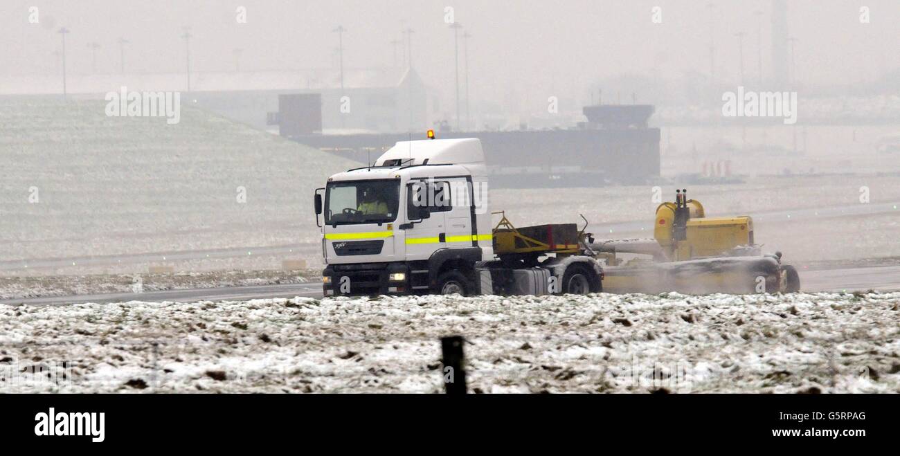 A runway is cleared of snow and slush at Birmingham International ...
