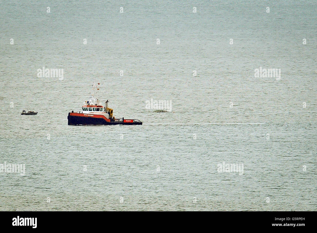 The Moto Vessel Emsstrom sinks into the sea. The boat was being towed ...