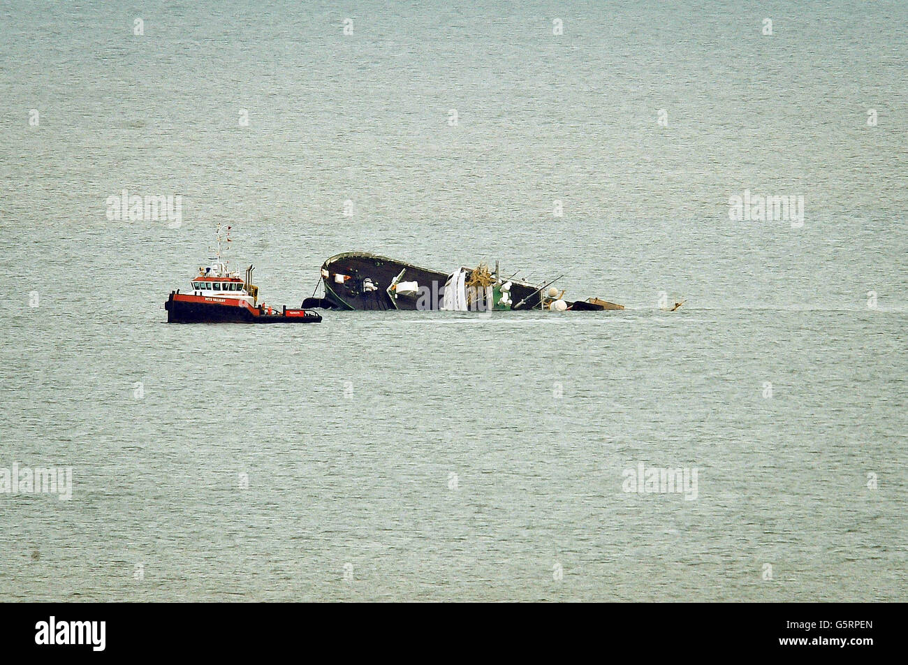 The Moto Vessel Emsstrom sinks into the sea. The boat was being towed ...
